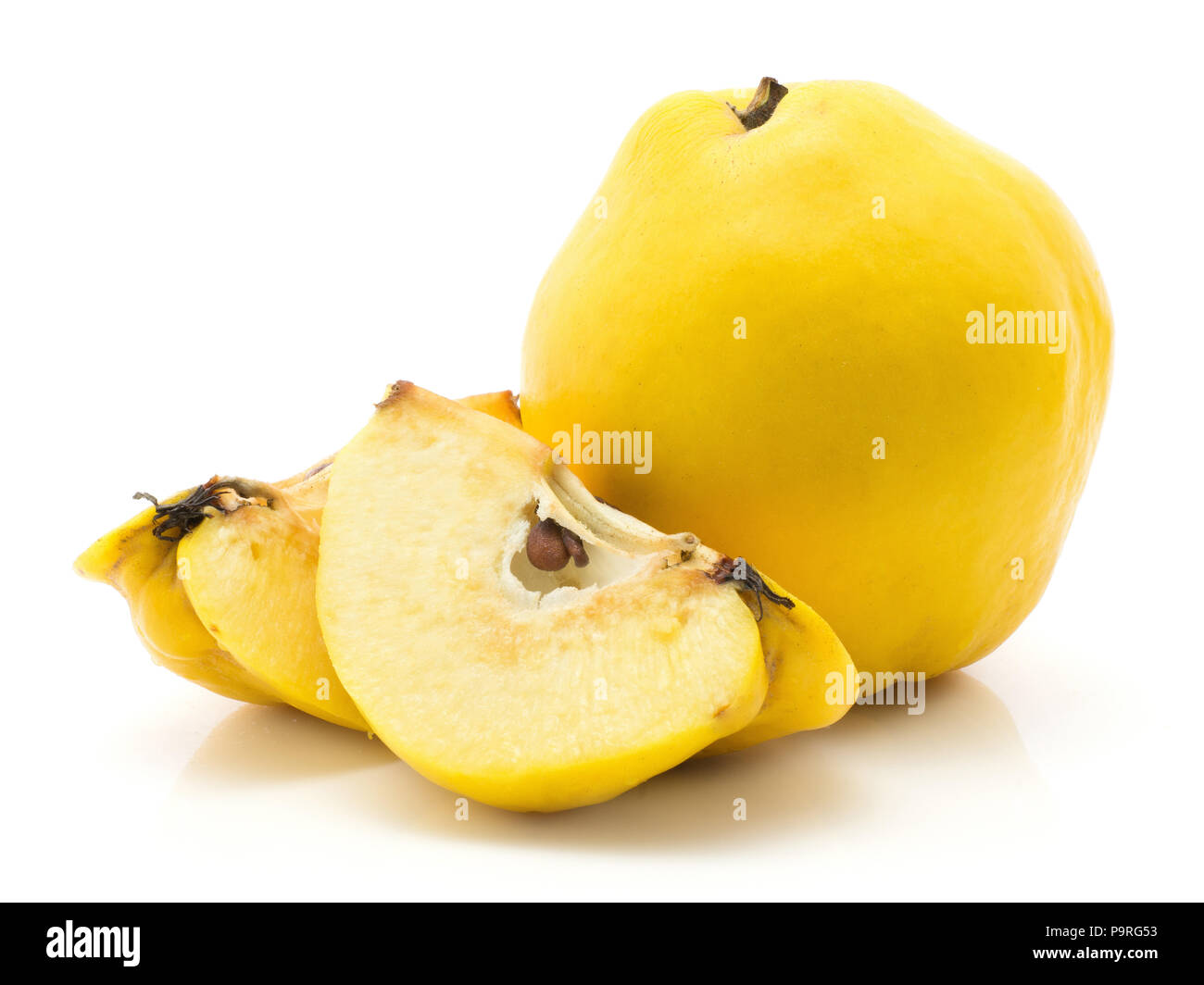 One quince and two slices isolated on white background raw yellow ripe ...