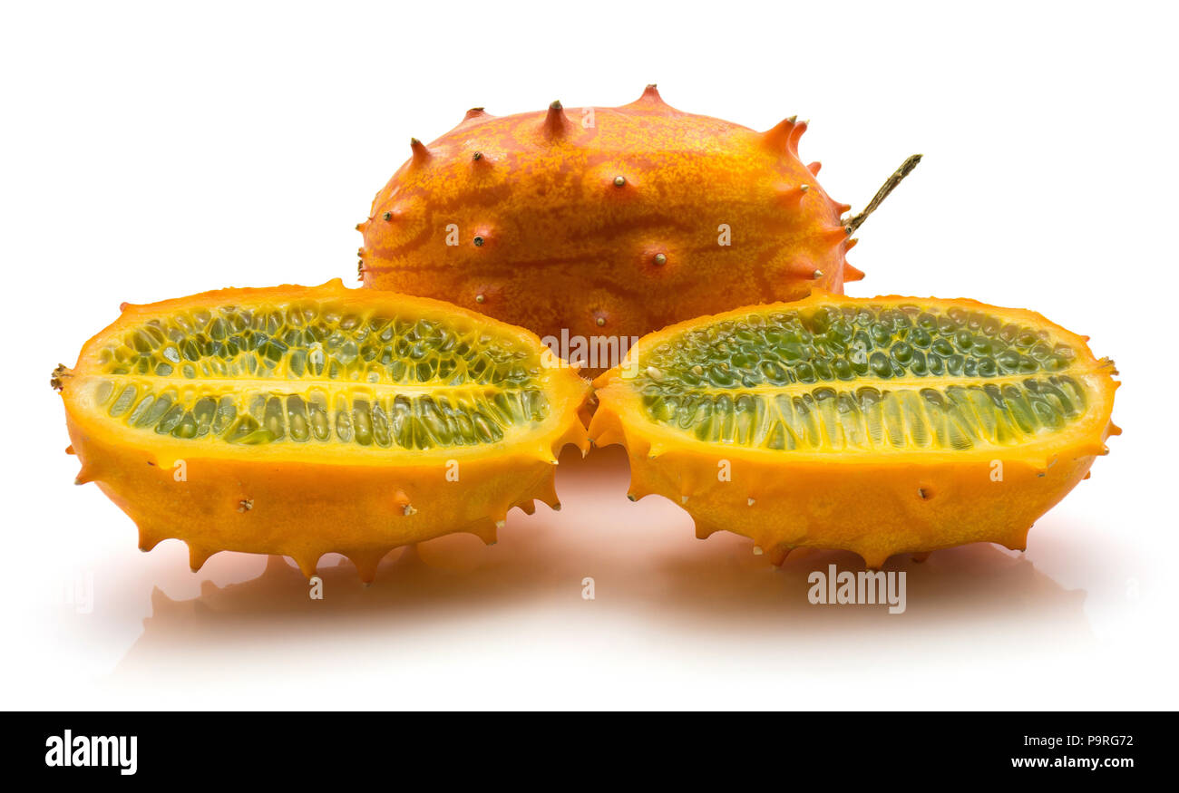 Sliced kiwano isolated on white background one whole one cut in half ...