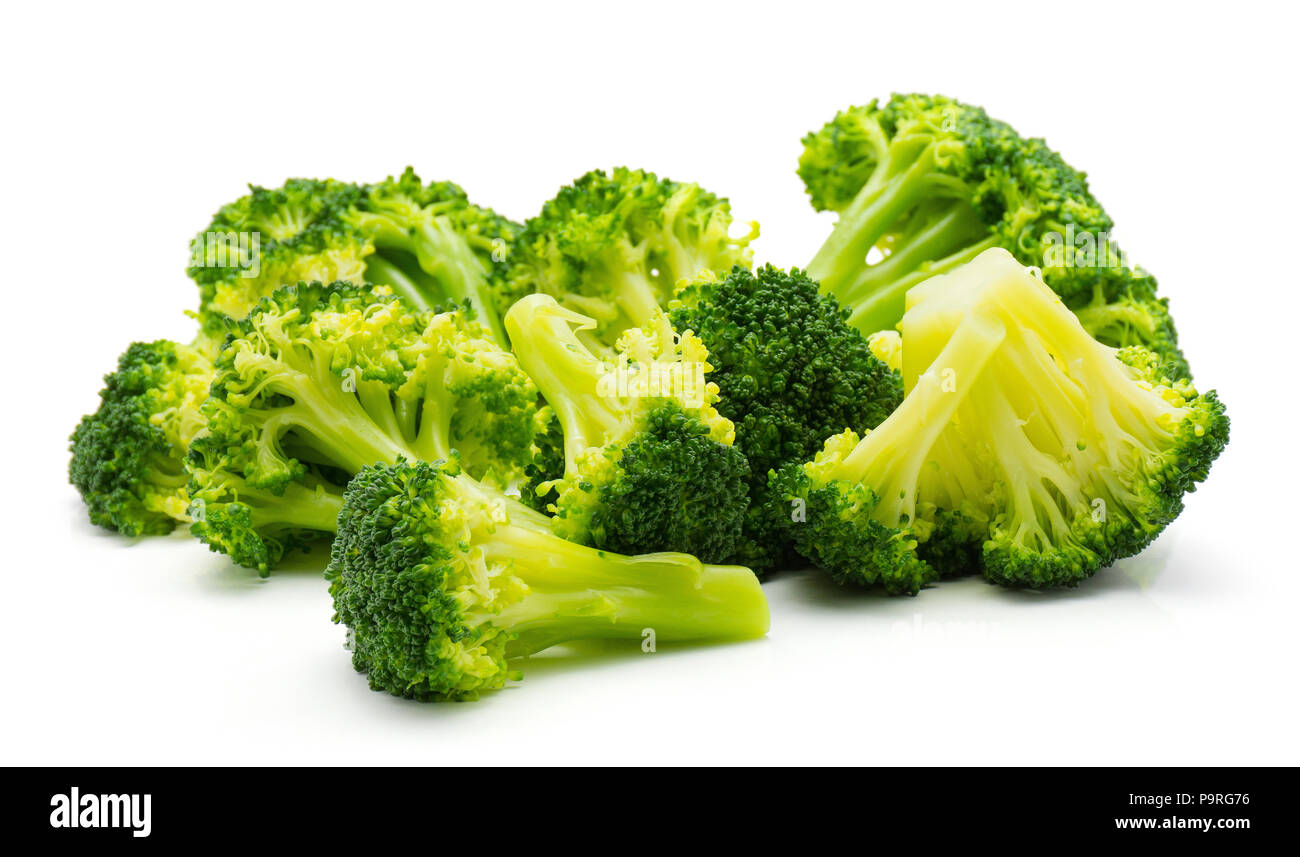 Steamed broccoli isolated on white background heap Stock Photo - Alamy