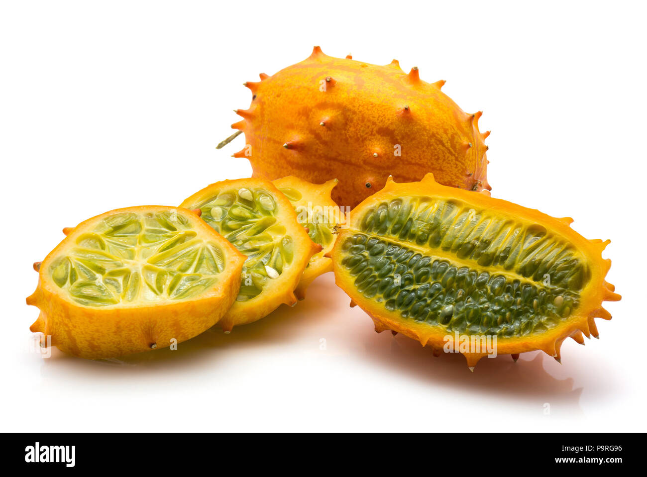 Sliced kiwano isolated on white background one whole one cross section ...