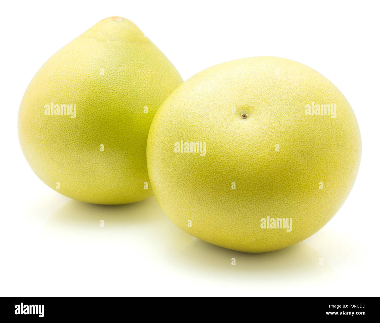 Two yellow pamelo isolated on white background Stock Photo - Alamy