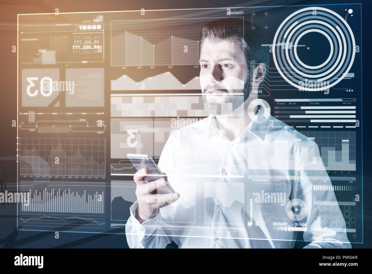 Working process. Calm attentive young web developer looking at the ...