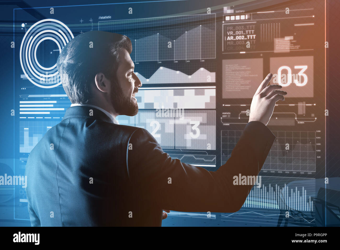 Transparent device. Positive emotional web developer looking satisfied with the results of his ...