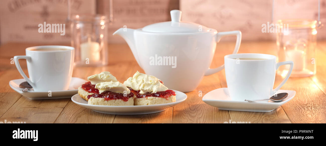 Cornish Cream Tea white crockery, tea pot, cups and saucers Stock Photo ...