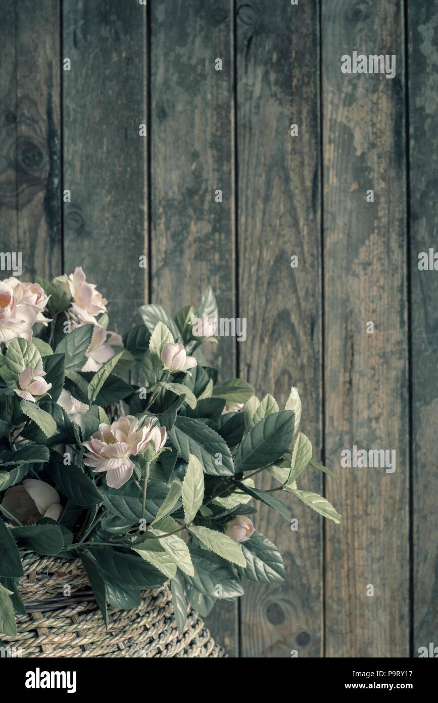 rag flowers in a basket. Wooden background with copy space Stock Photo ...