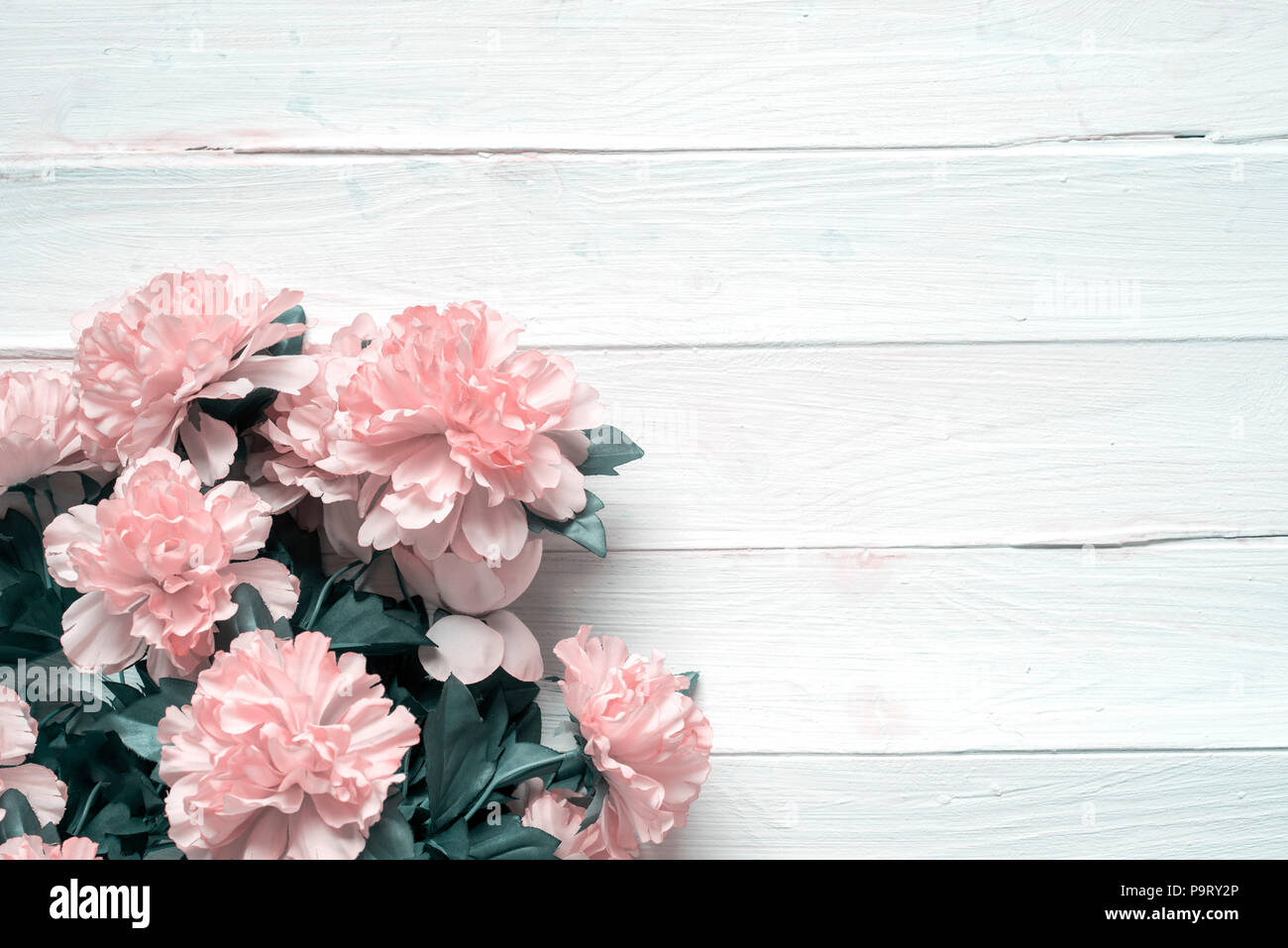 rag flowers. Wooden background with copy space Stock Photo - Alamy