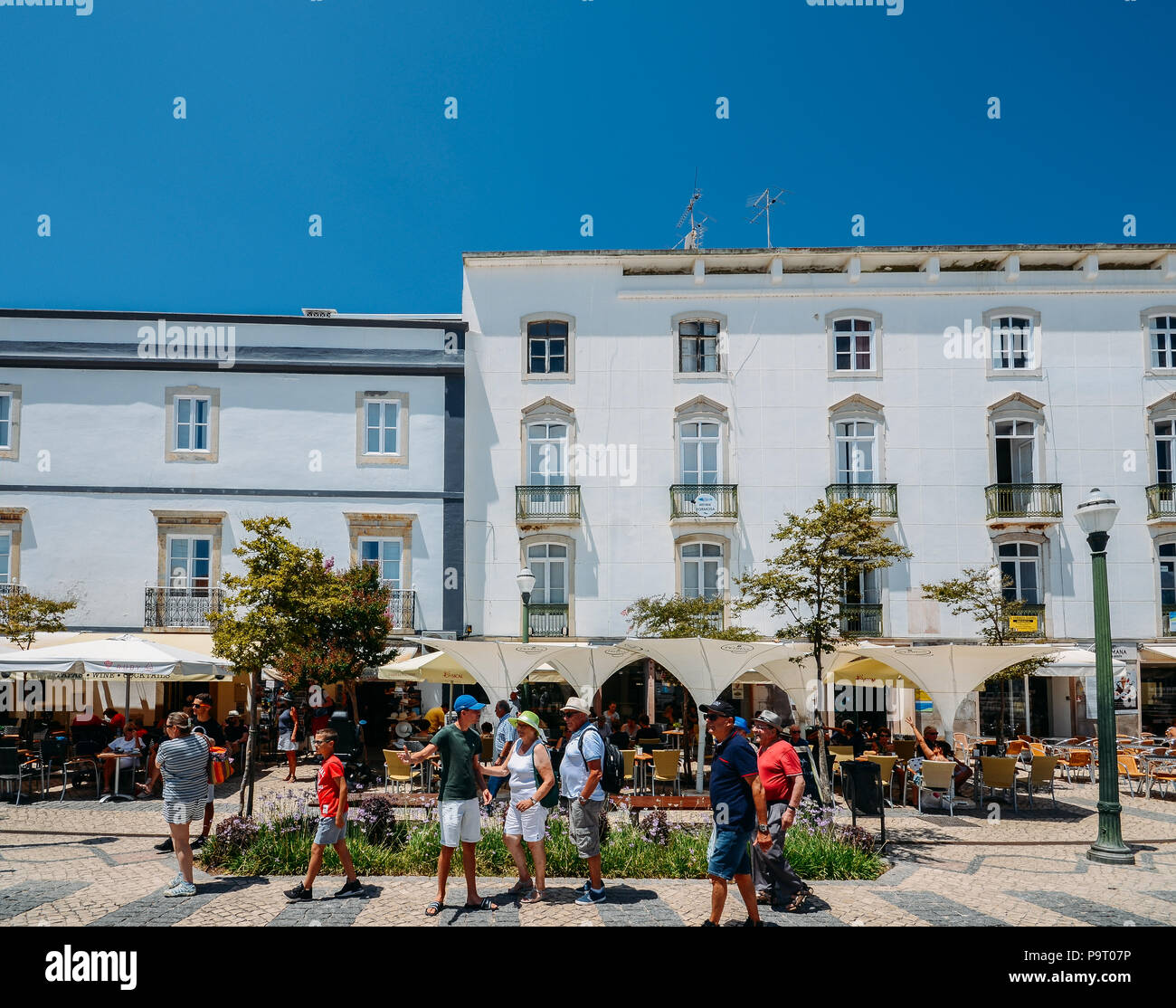 Traditional narrow streets in the historic centre of Tavira town ...