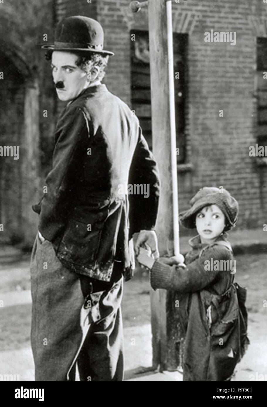 Charlie chaplin the kid (1921) hi-res stock photography and images - Alamy