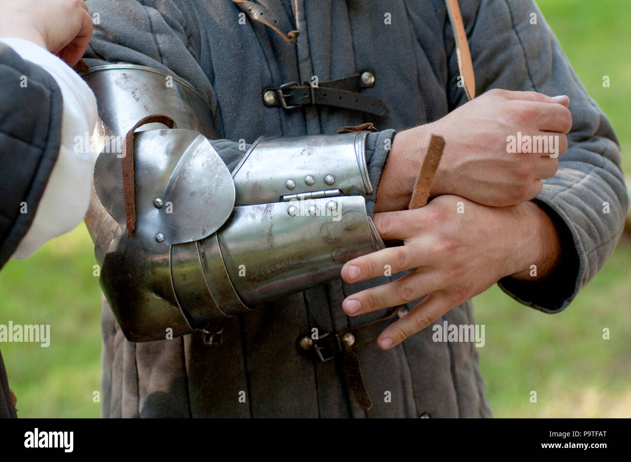 Medieval Knight Dressing in Armor Stock Photo - Alamy