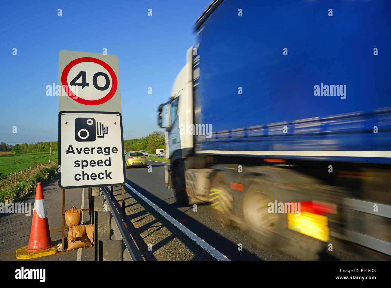 lorry passing warning sign of 40mph limit and speed camera warning sign ... lorry passing warning sign of 40mph limit and speed camera warning sign ...