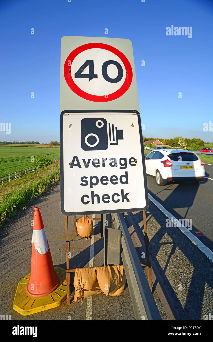 lorry passing warning sign of 40mph limit and speed camera warning sign ... lorry passing warning sign of 40mph limit and speed camera warning sign ...
