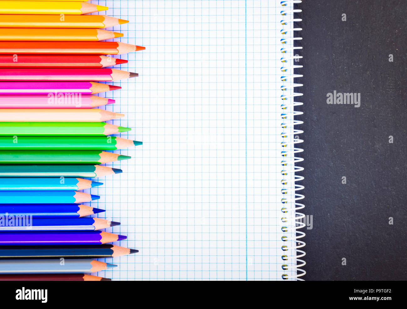 Back to school pencils rainbow on ruled paper of notebook, retro toned ...