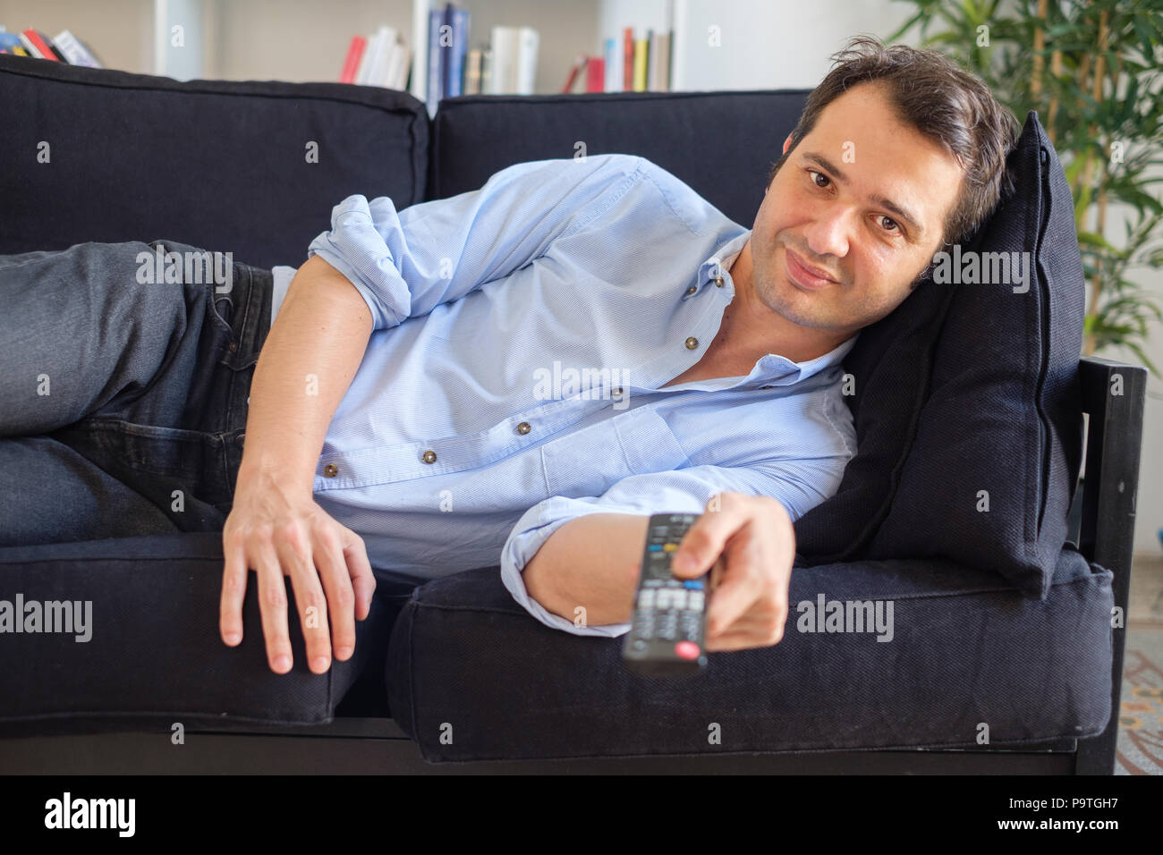 Changing channels on tv television hi-res stock photography and images ...