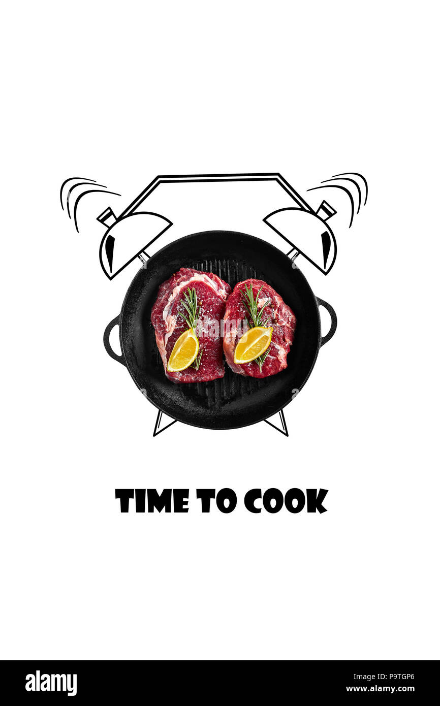 Time to cook. Dinner time. Raw steaks on a black frying pan and alarm ...