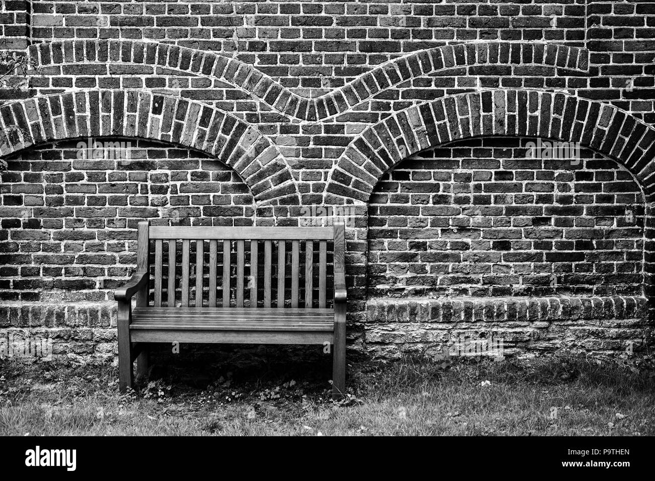 Bench brick wall hi-res stock photography and images - Alamy