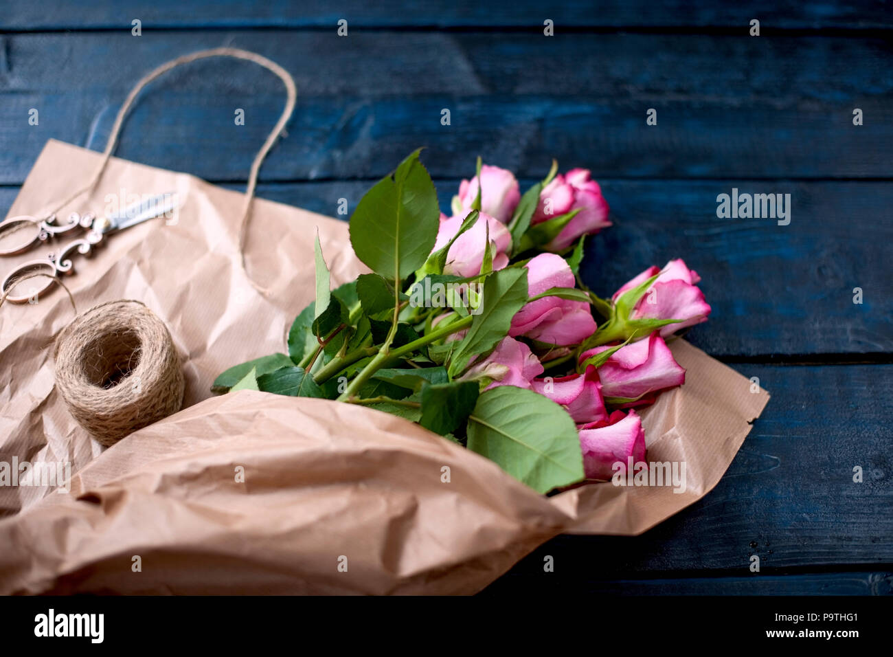 A bouquet of pink roses in brown paper. Color pastry macaroni. Free ...
