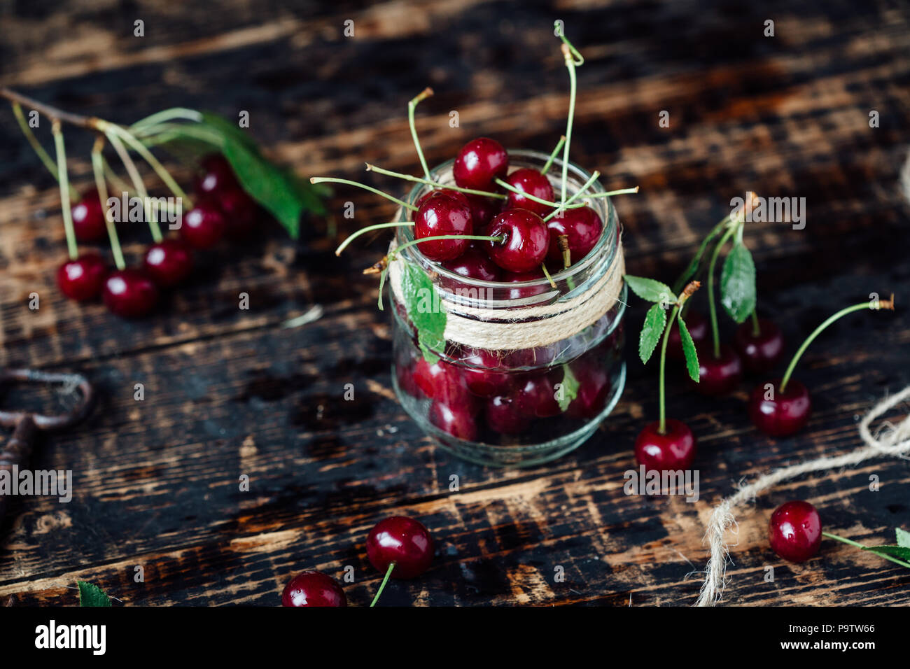 Fresh ripe cherries on a wooden table. Wooden background Stock Photo ...