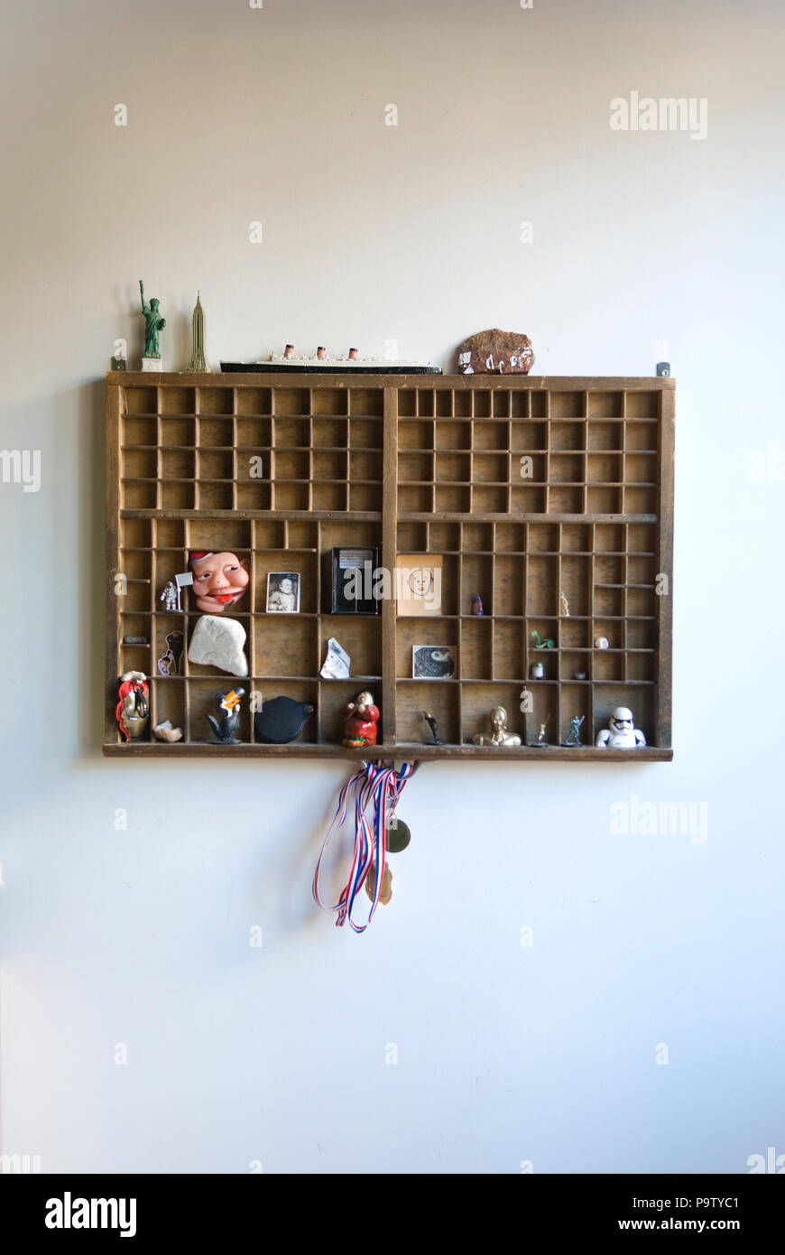 interior shot of old printers drawer on wall of kid’s bedroom filled ...