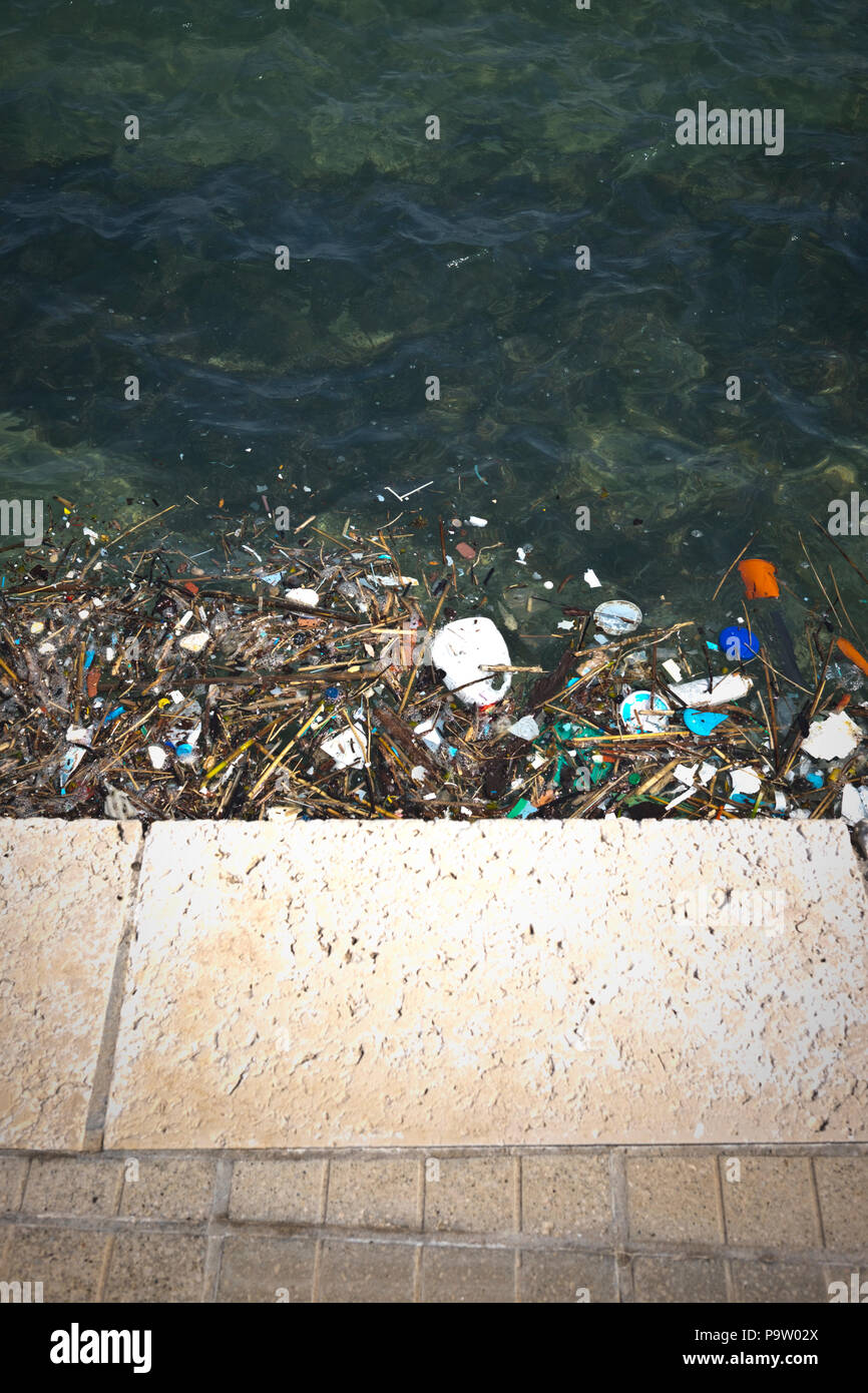 a depressing landscape view from a seawall in Croatia looking down at ...