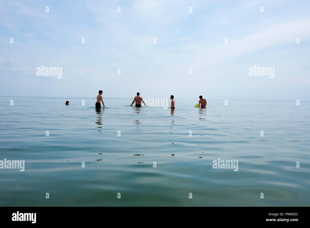 The sea up to their waists hi-res stock photography and images - Alamy