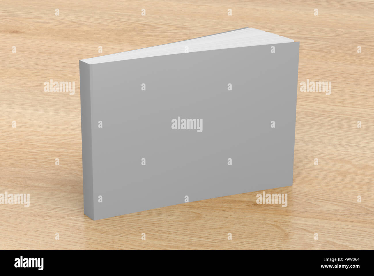 Blank gray horizontal soft cover book standing on wooden background ...