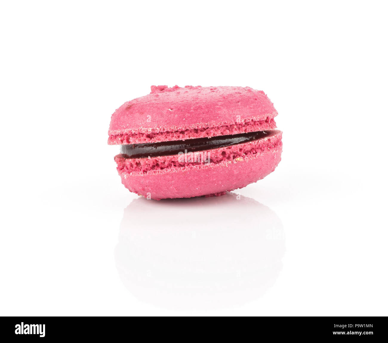 Pink French macaron isolated on white background one with raspberry jam ...