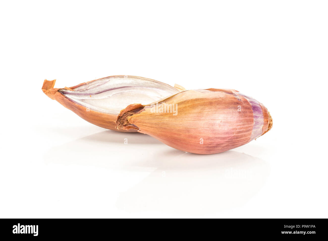 One golden shallot with a half isolated on white background Stock Photo ...