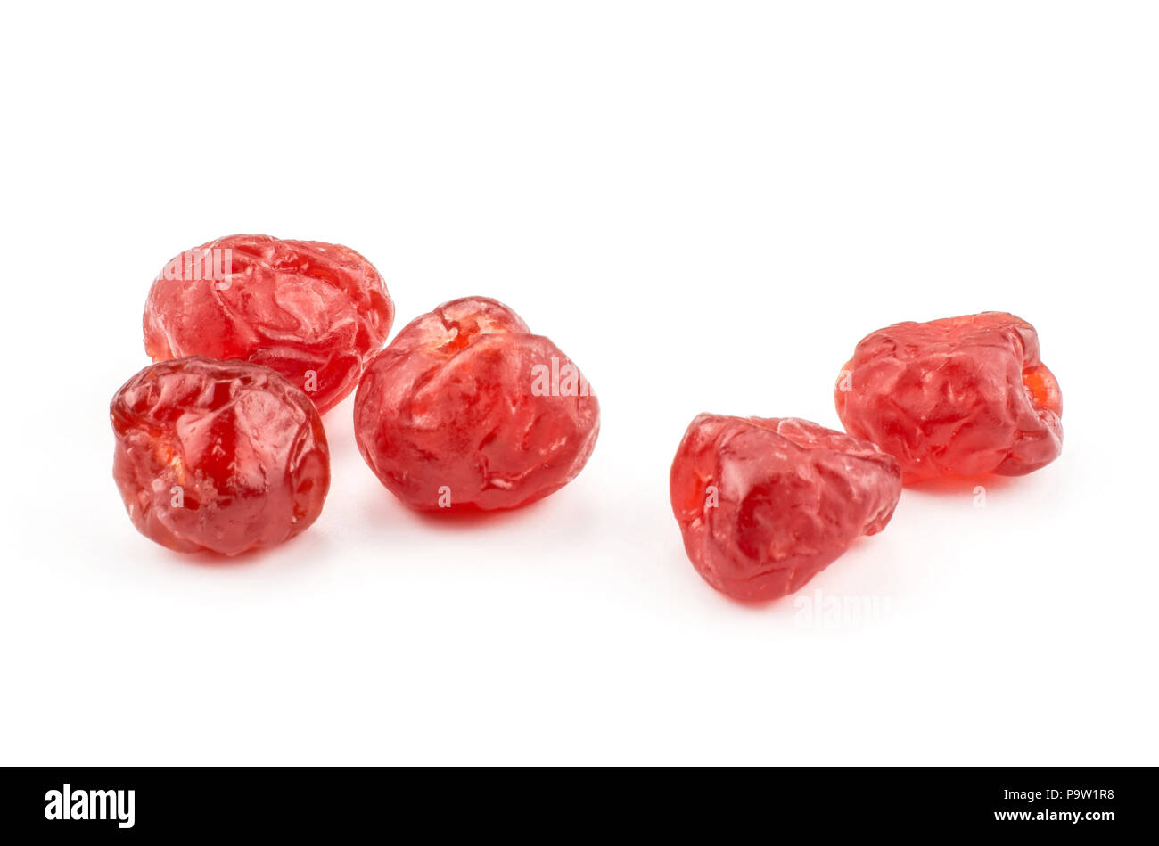 Five red dry cherries isolated on white background Stock Photo - Alamy