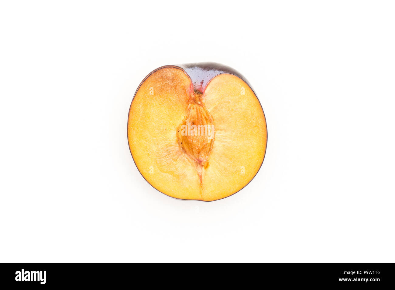 One red blue plum half top view isolated on white background section ...