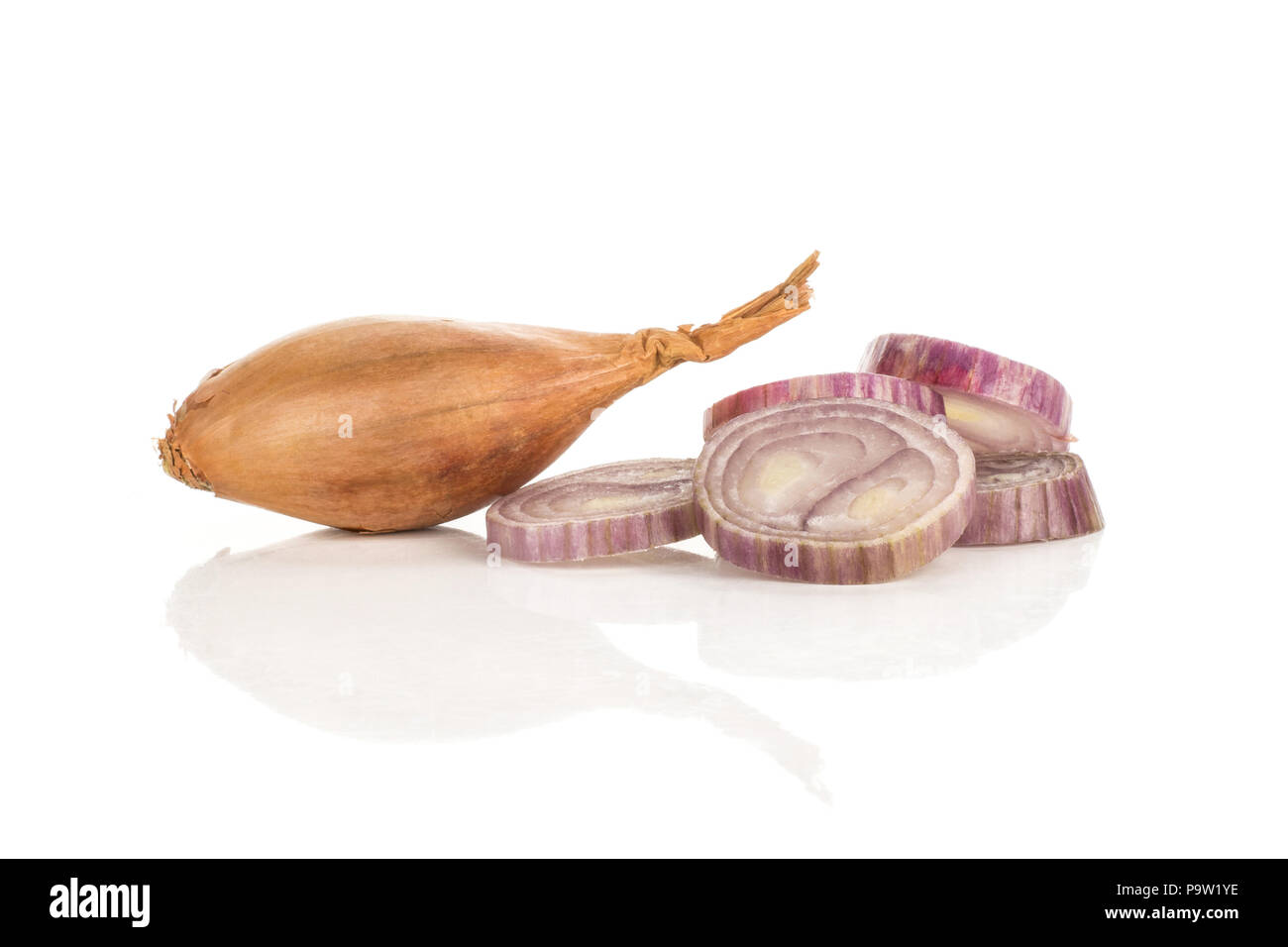 One golden shallot and ring slices stack isolated on white background ...