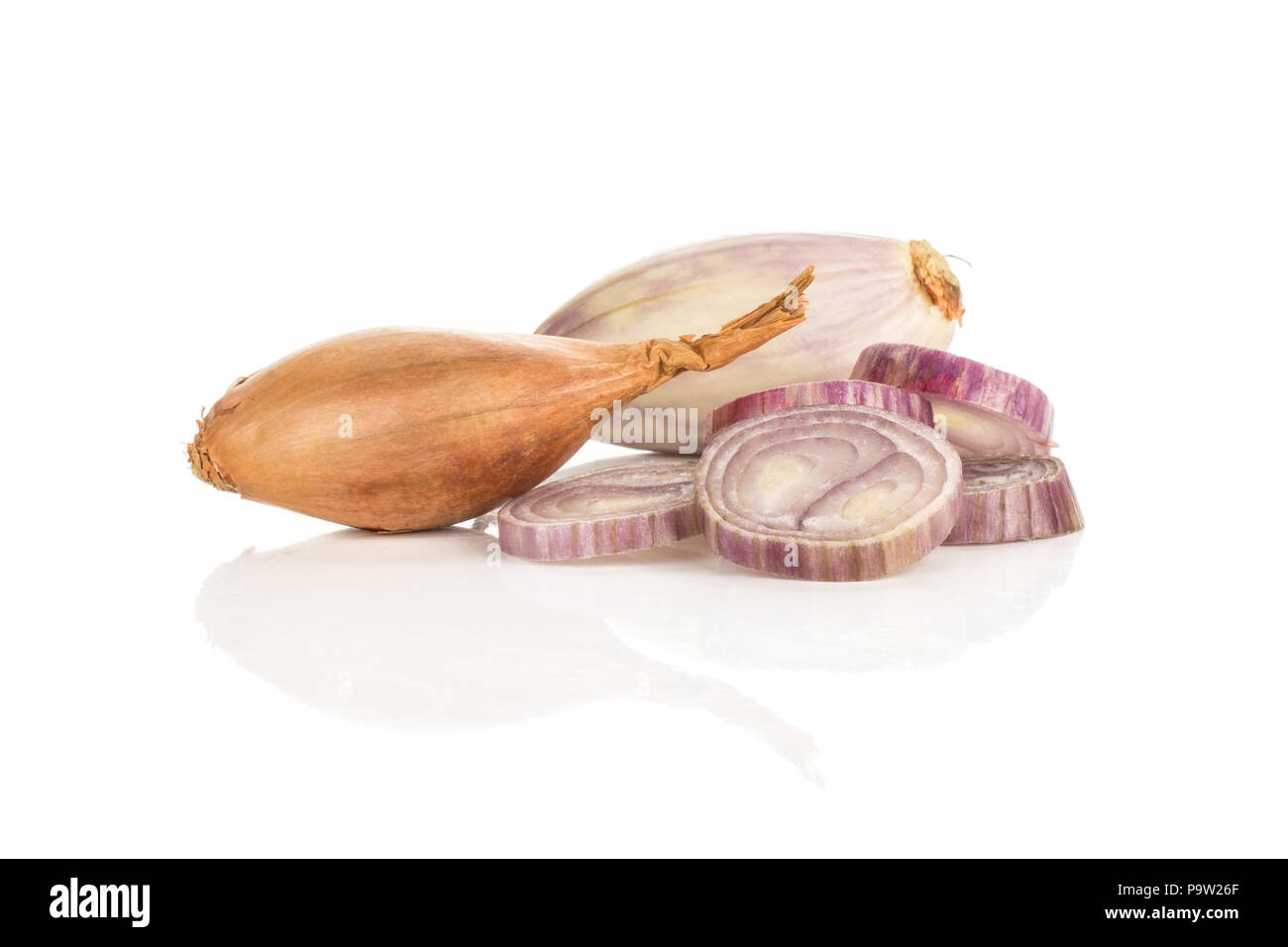 Two golden shallots and ring slices stack isolated on white background ...