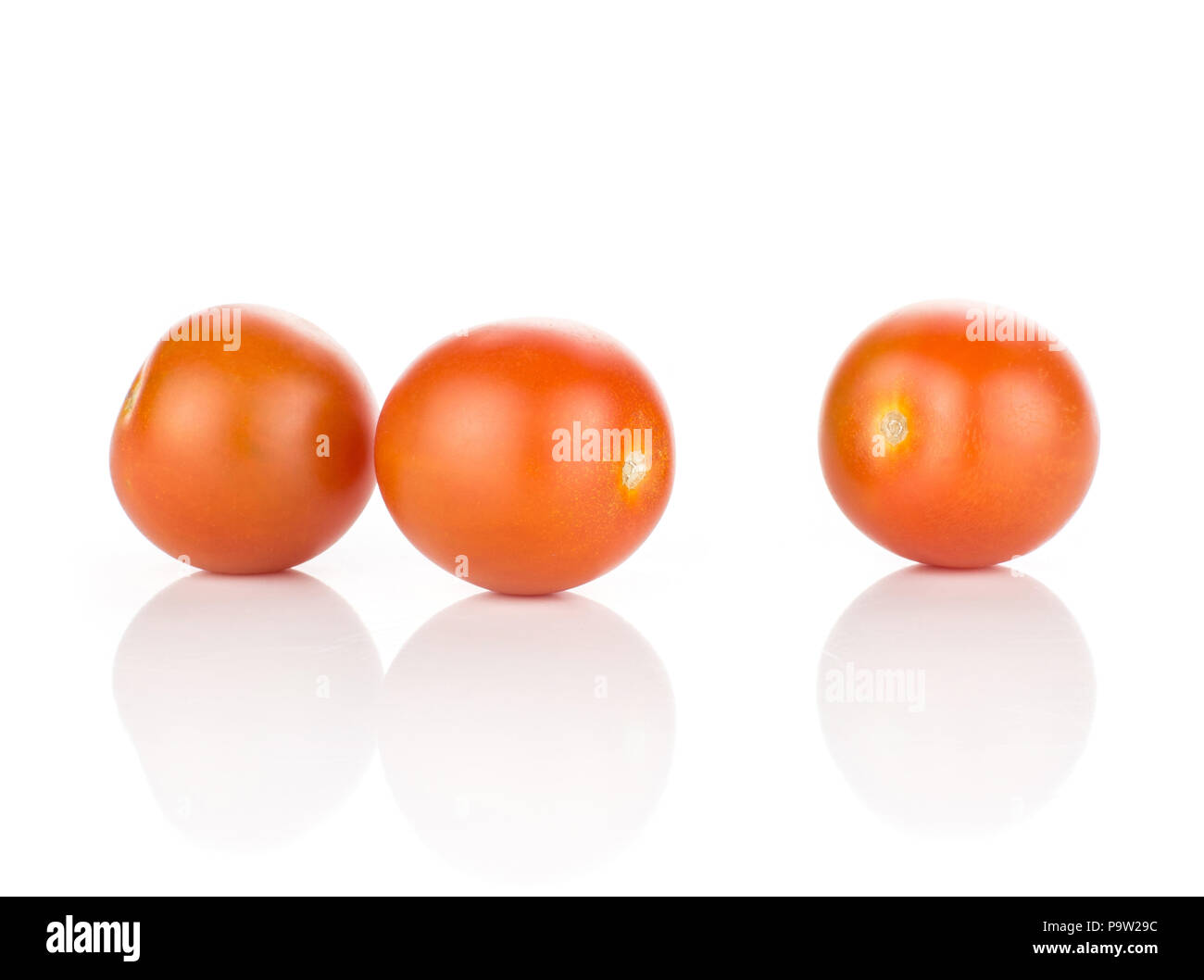 Three red grape cherry tomatoes isolated on white background Stock Photo - Alamy