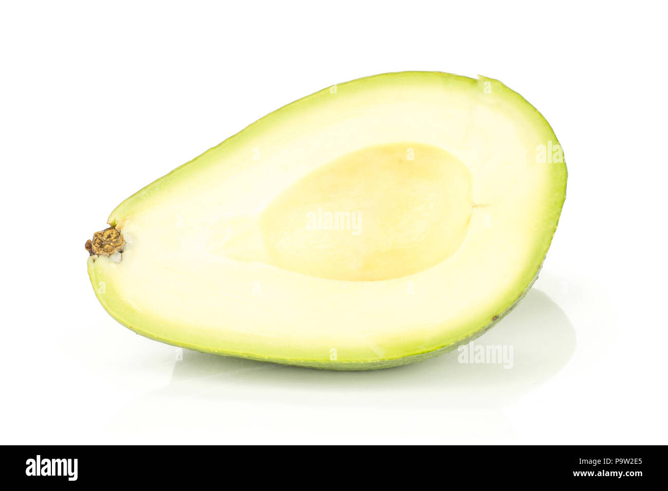 One green smooth avocado half without seed isolated on white background ...
