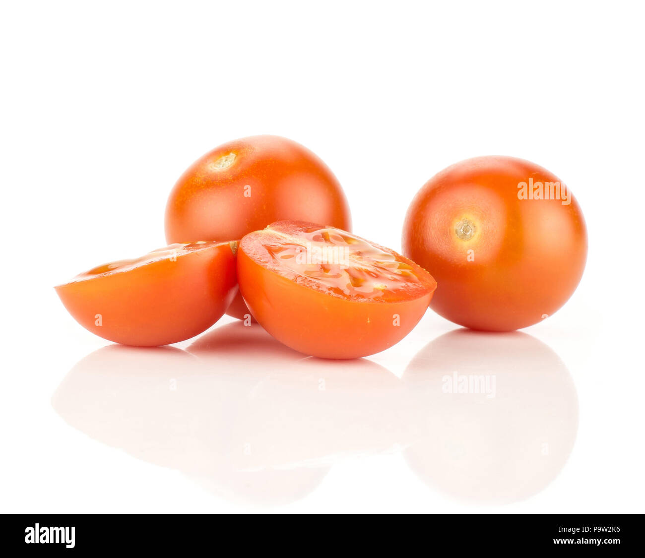 Red grape cherry tomatoes two whole and two halves isolated on white background Stock Photo - Alamy