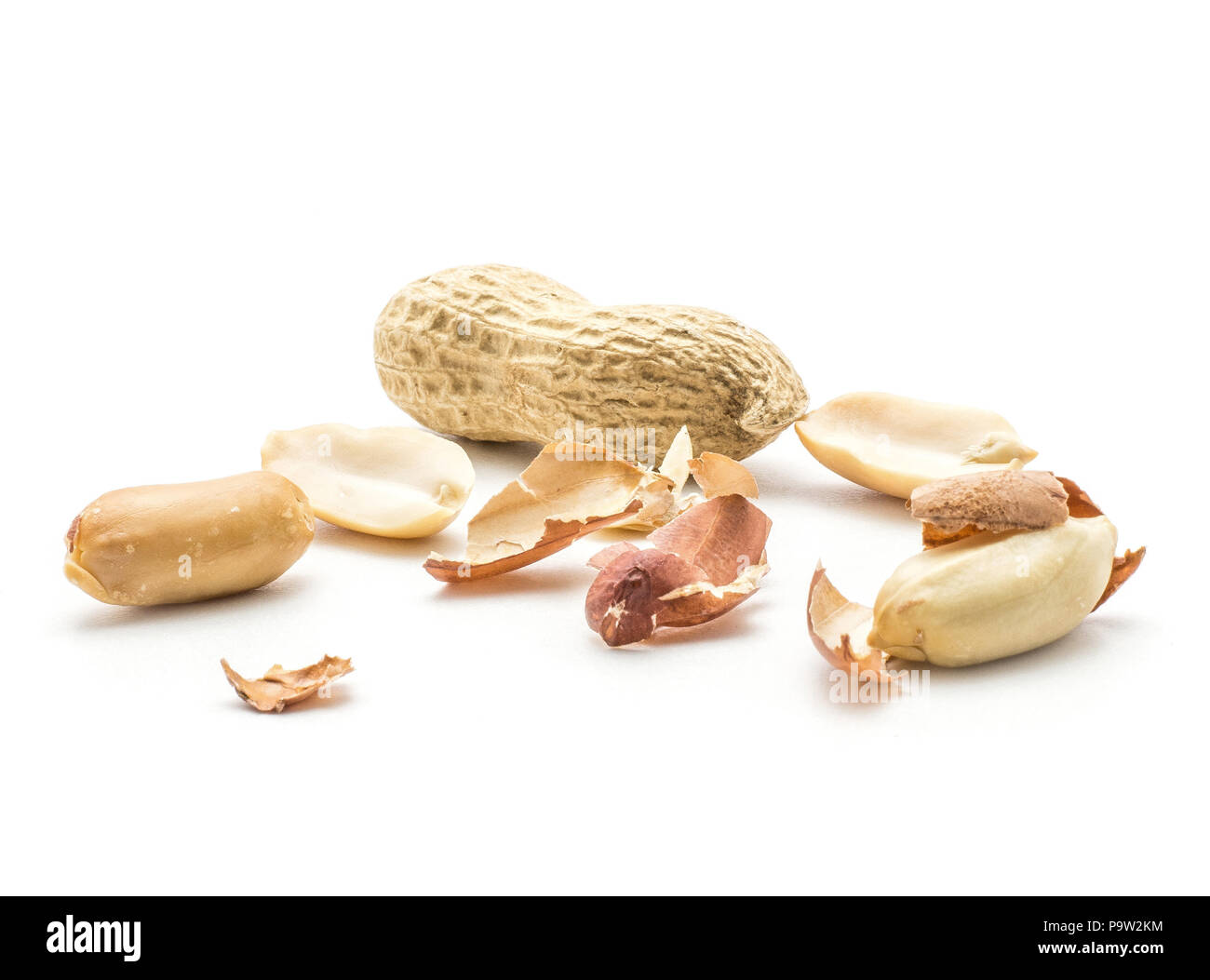 Peanuts stack isolated on white background (shelled in husk, unshelled ...