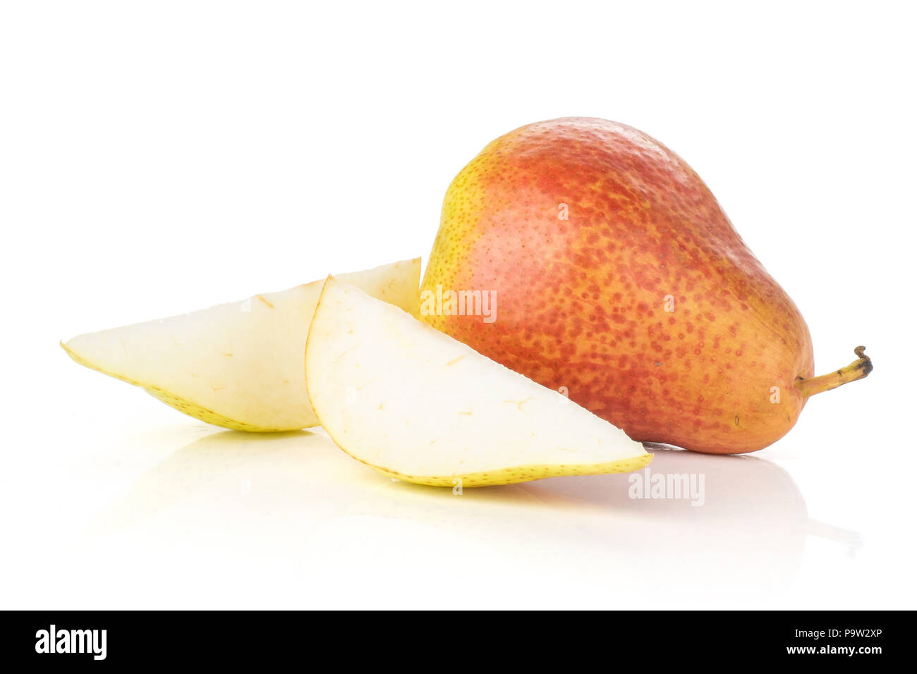 Group of one whole two slices of fresh red pear forelle variety ...