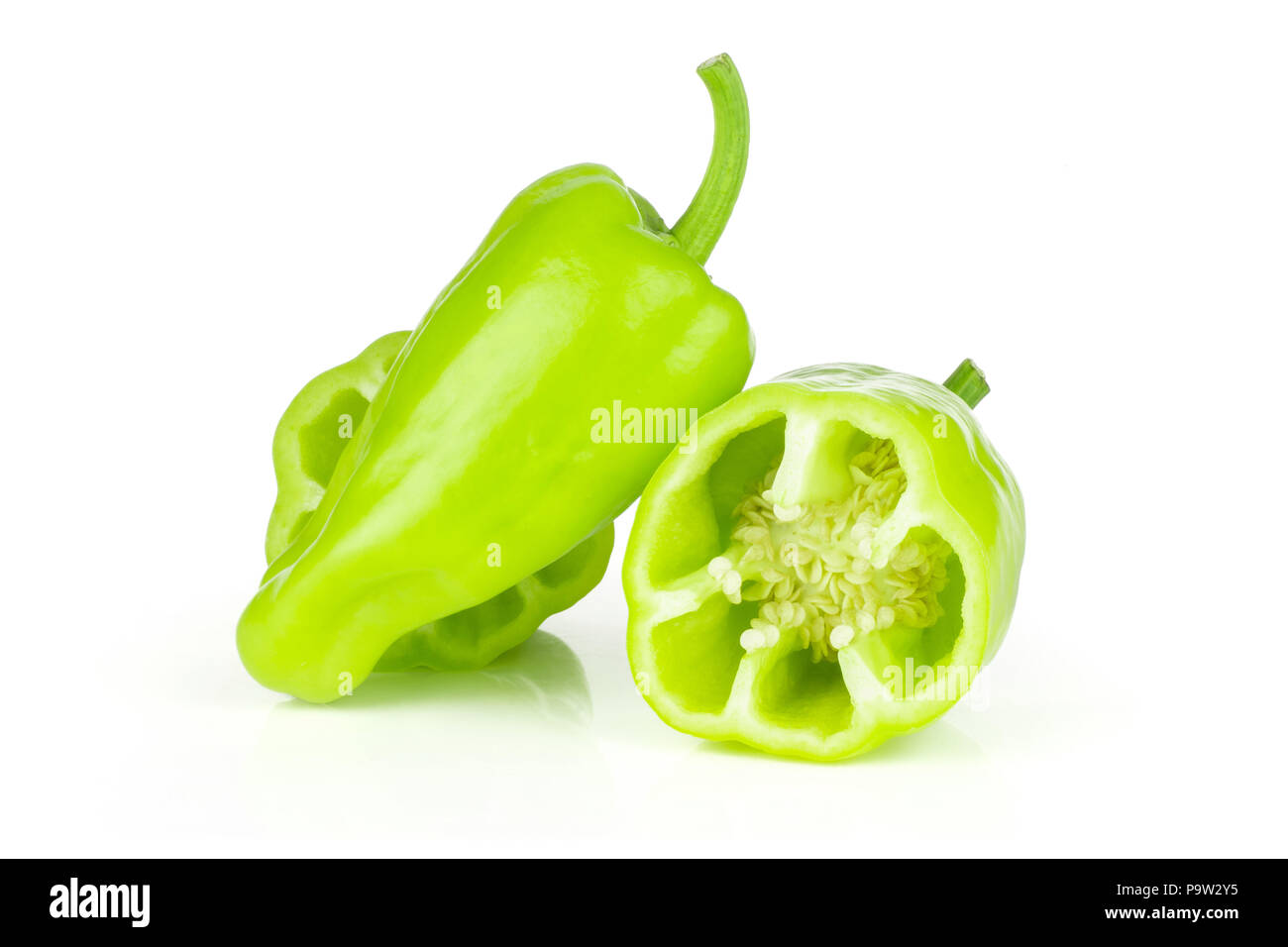 Group of one whole two halves of light green bell pepper isolated on ...