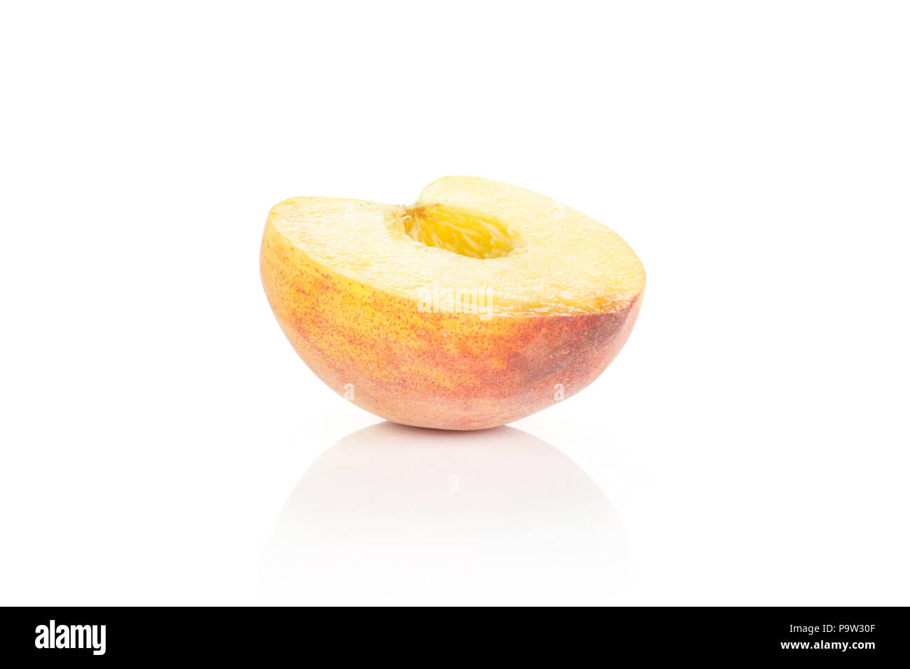 One yellow peach half without drupe isolated on white background Stock ...