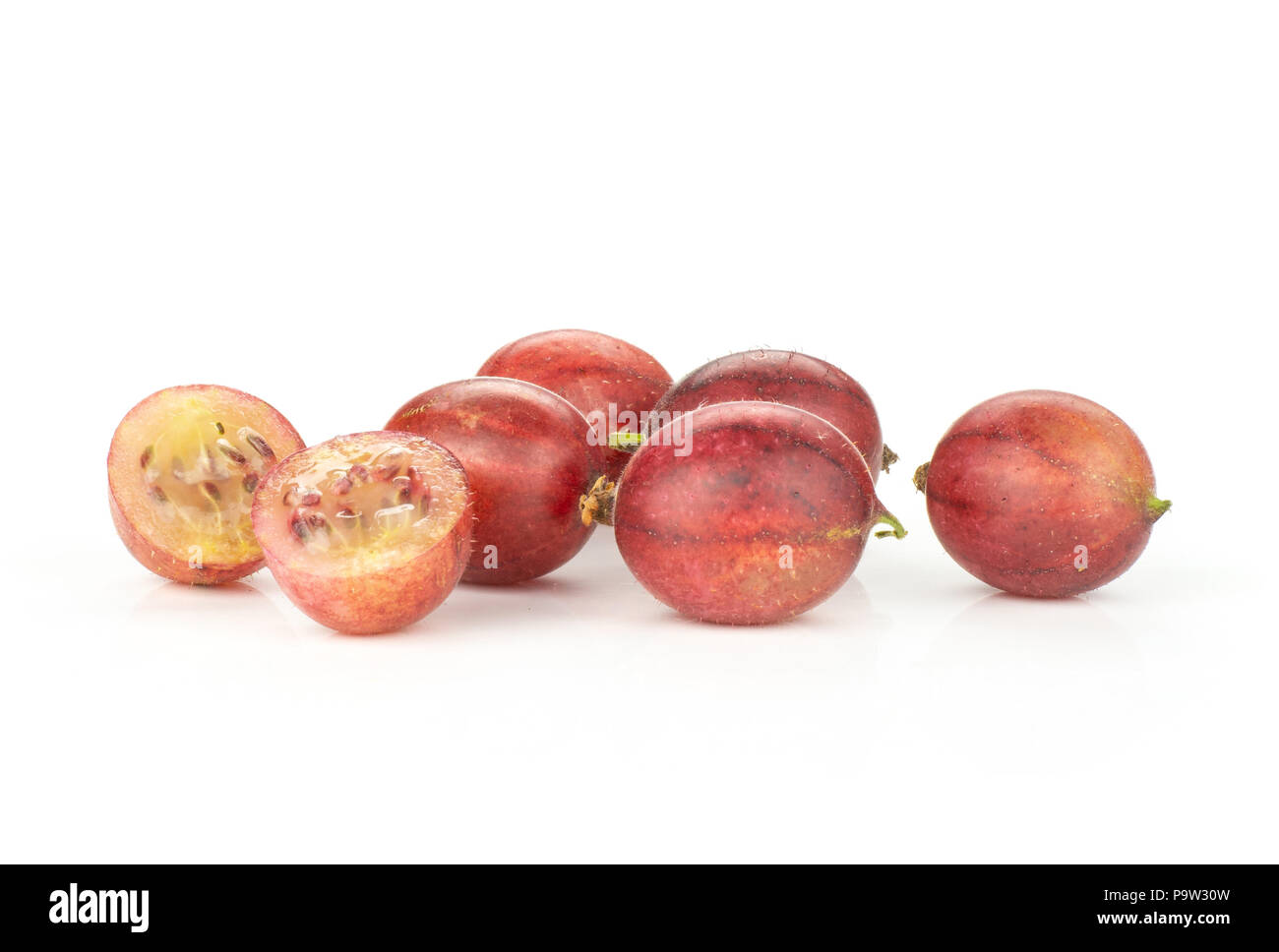 Group of five whole two halves of fresh red gooseberry hinnomaki ...