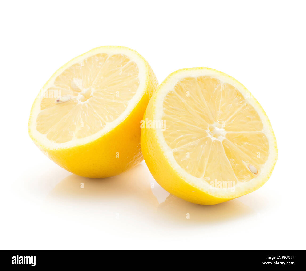 Two lemon halves isolated on white background yellow cross section ...