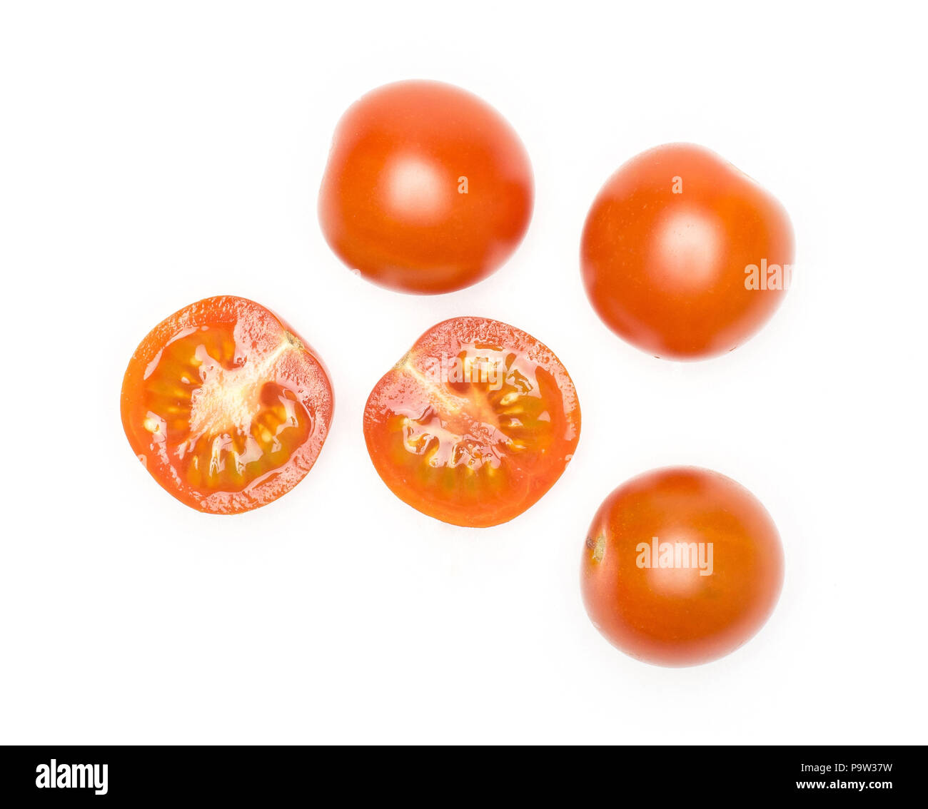 Red grape cherry tomatoes set top view isolated on white background three whole and two halves ...