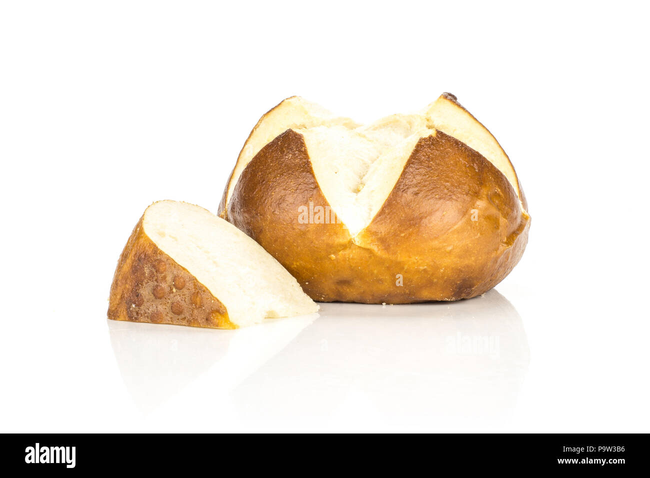 One Bavarian bread bun and a slice isolated on white background fresh ...
