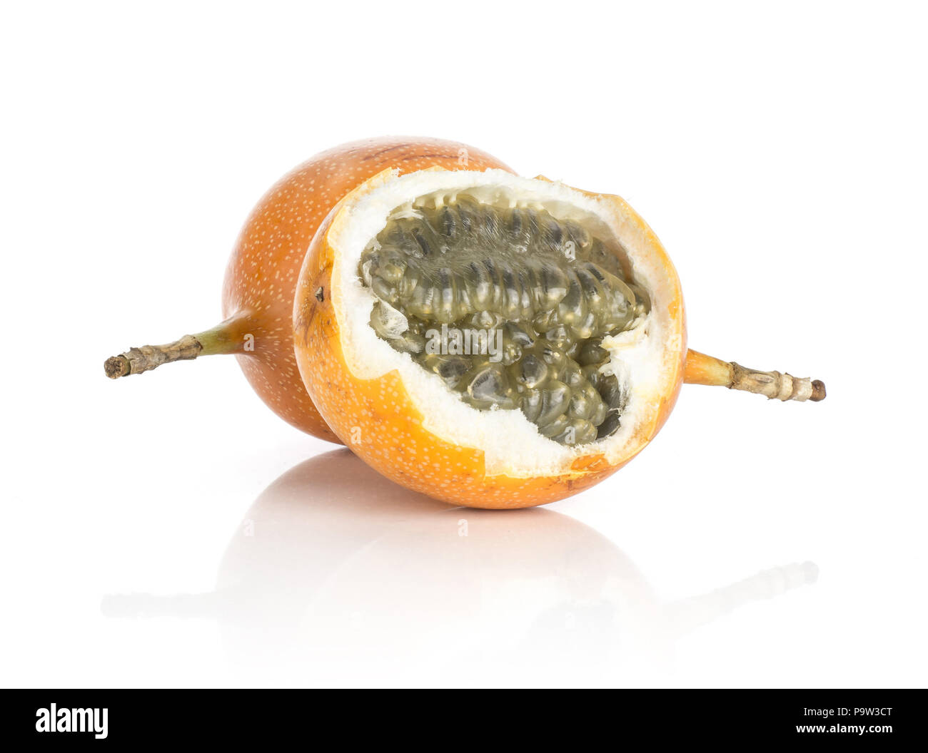 Two giant grenadilla one split with juicy flesh isolated on white ...