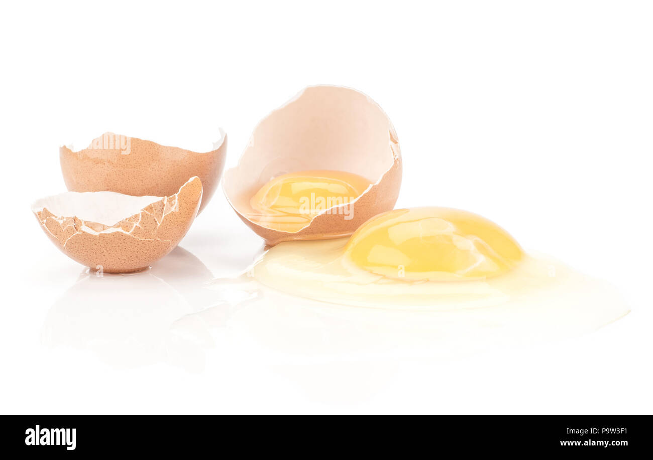 Cracked brown chicken egg with one separated yolk isolated on white ...