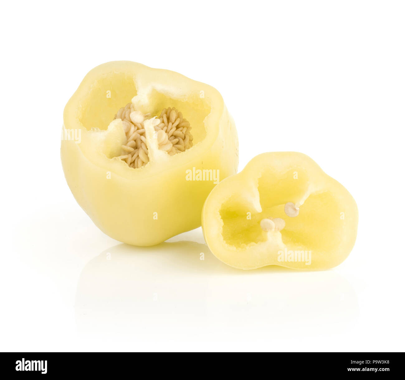 One white paprika cut in two halves (Hungarian sweet pepper) isolated ...