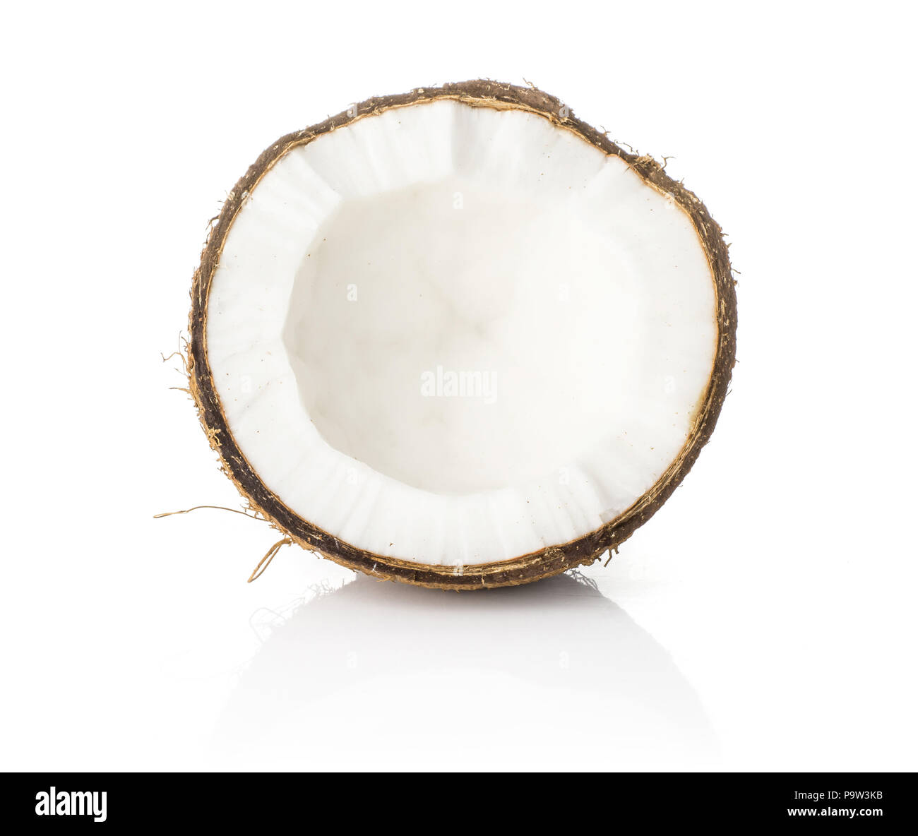 One coconut section half isolated on white background cracked brown ...