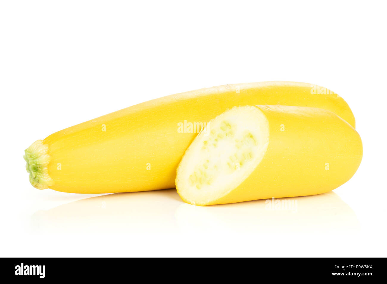 Group of one whole one half of raw yellow zucchini isolated on white ...
