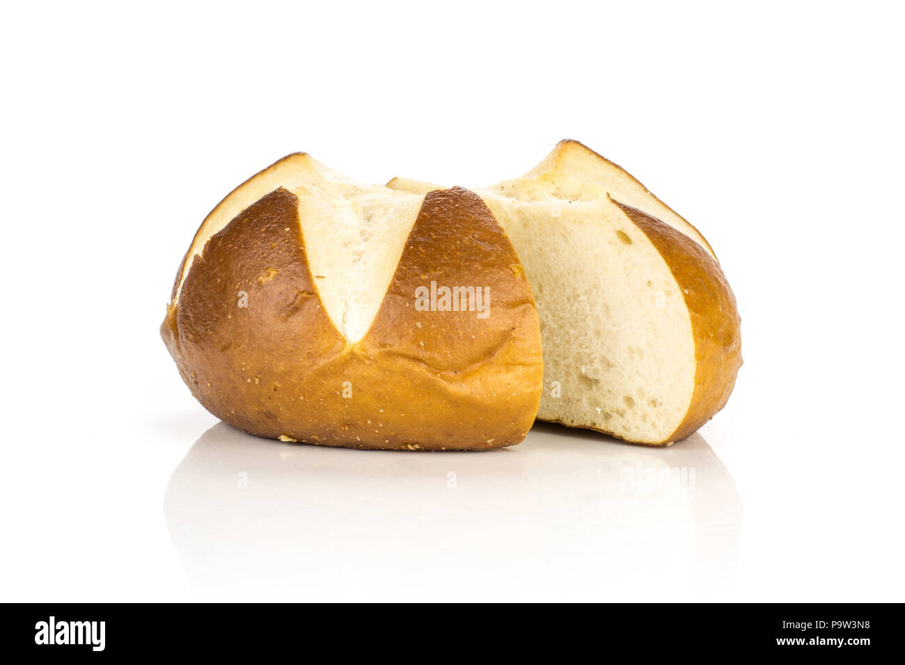 Sliced Bavarian bread bun one cut in two halves isolated on white ...