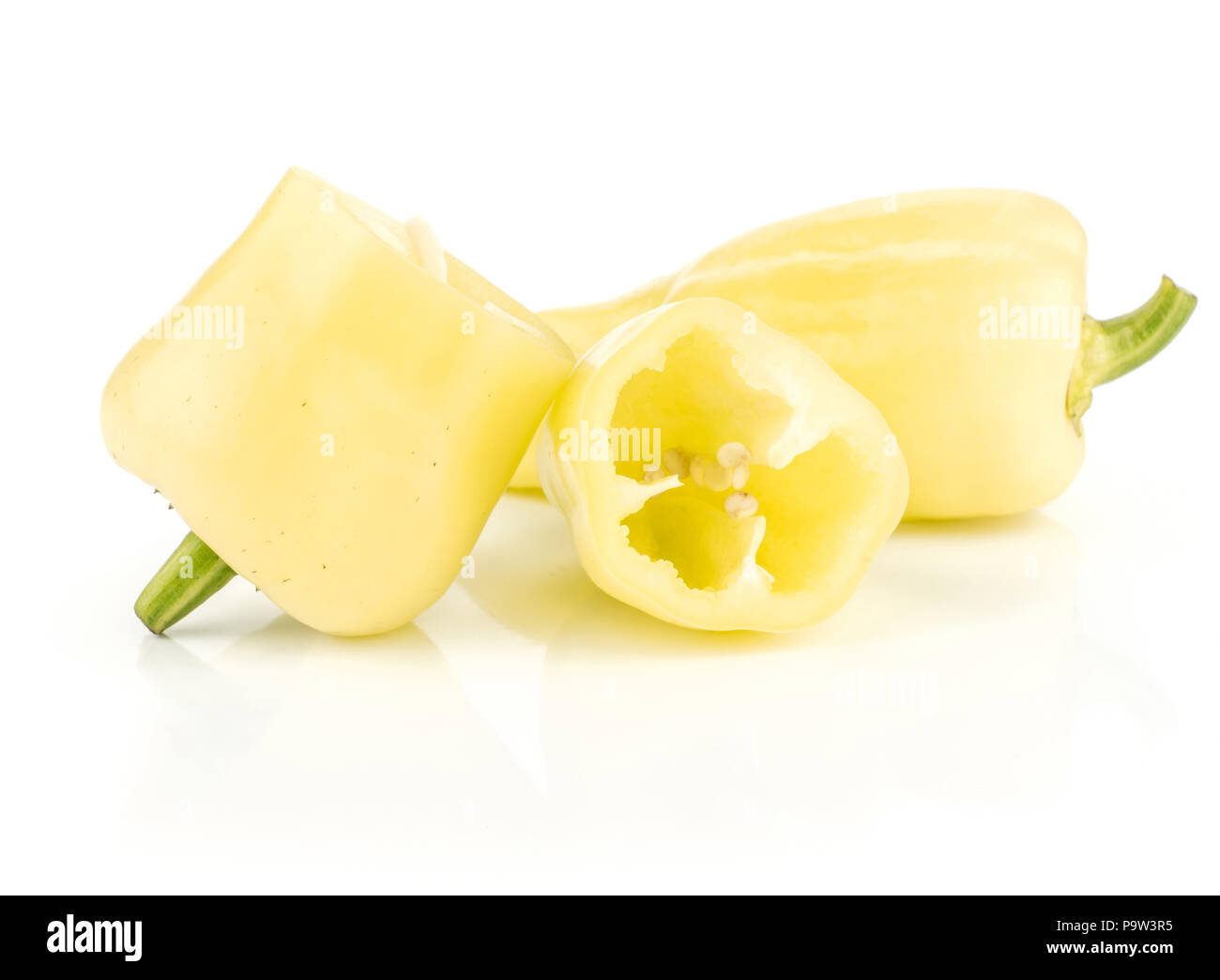 Sliced white paprika (Hungarian sweet pepper) and one while isolated on ...
