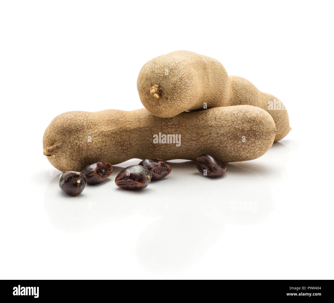 Two tamarind in a brittle shell with five flat glossy seeds isolated on ...
